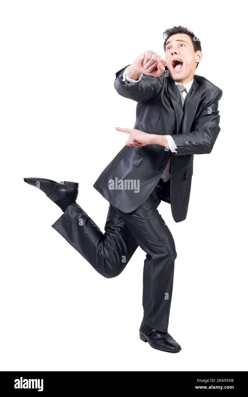 Funny guy gesturing and running in studio Stock Photo - Alamy