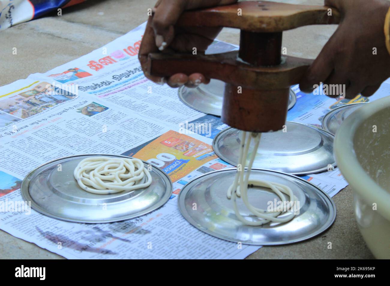 Preparing South Indian Homemade rice Murukku for Diwali festival snacks ...