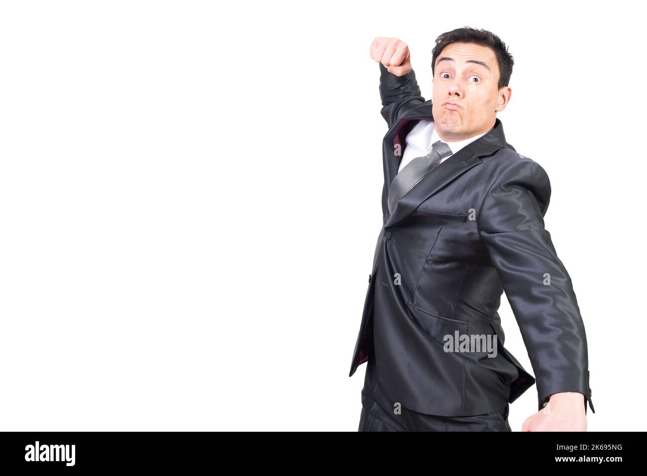 Nervous young man punching camera in white studio Stock Photo - Alamy