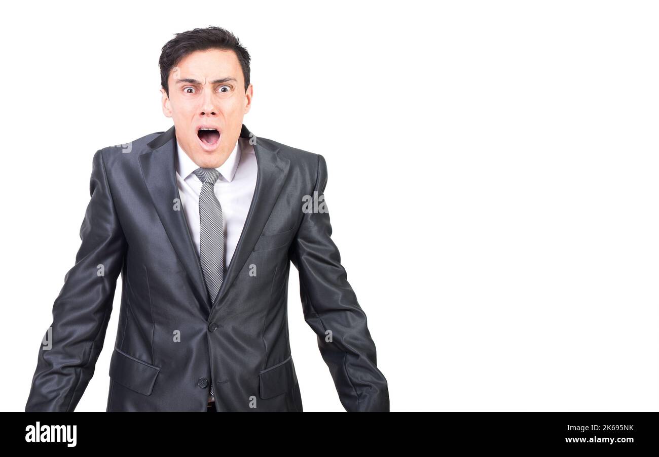 Panicked young man with opened mouth against white background Stock ...