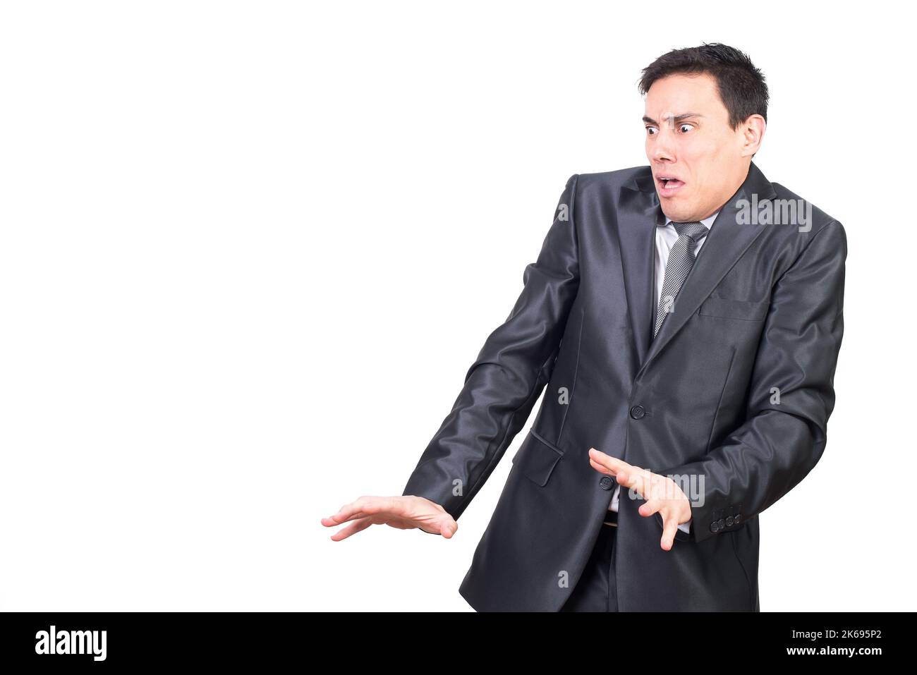 Scared young guy in horror looking away in studio Stock Photo - Alamy