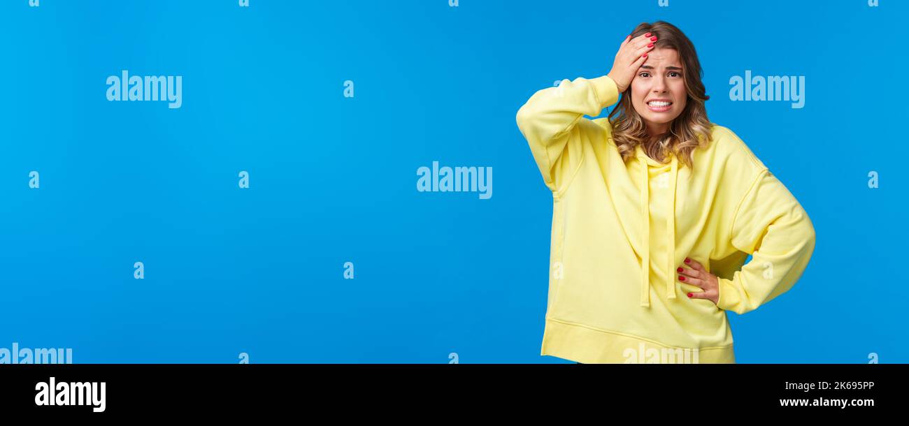 Embarrassed and worried girl bumped into car, feel anxious and ...