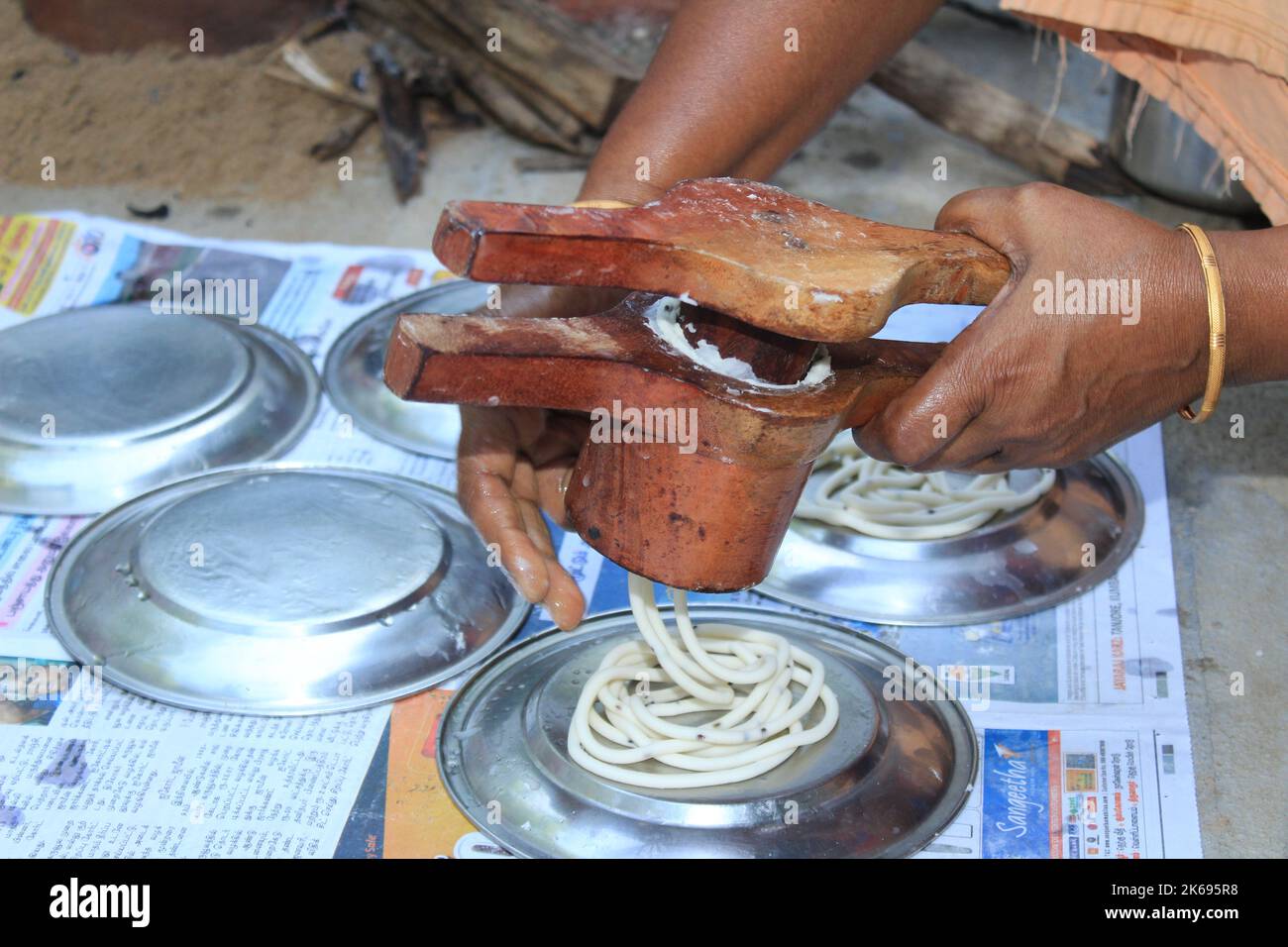 Preparing South Indian Homemade rice Murukku for Diwali festival snacks ...