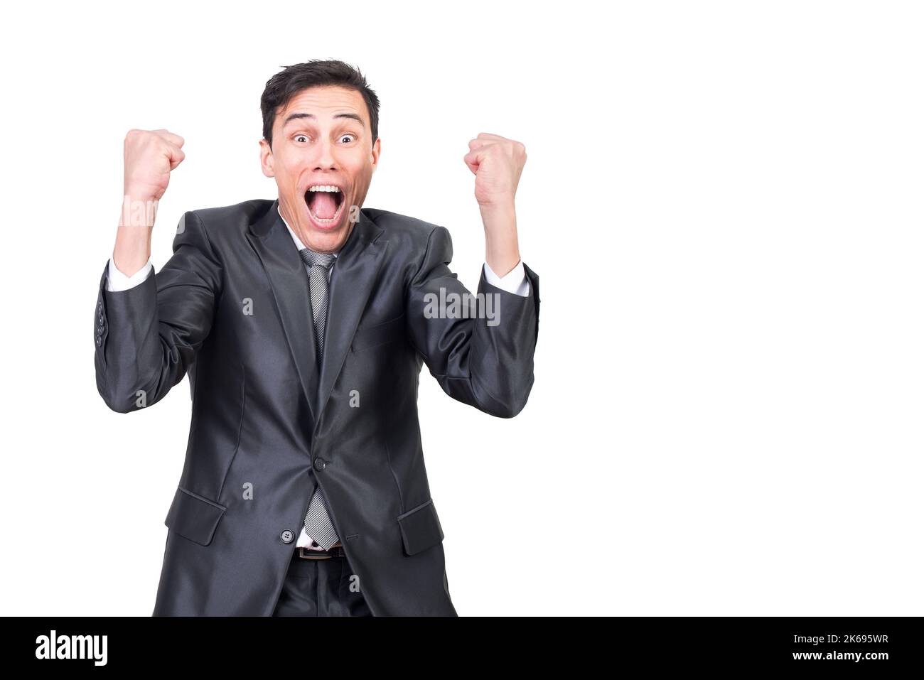 Cheerful young man screaming while celebrating successful deal Stock ...