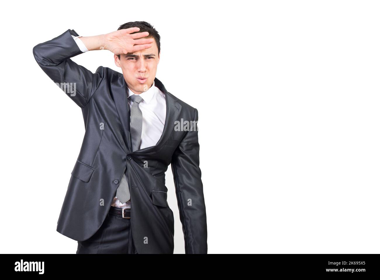 Exhausted young businessman touching forehead hi-res stock photography ...
