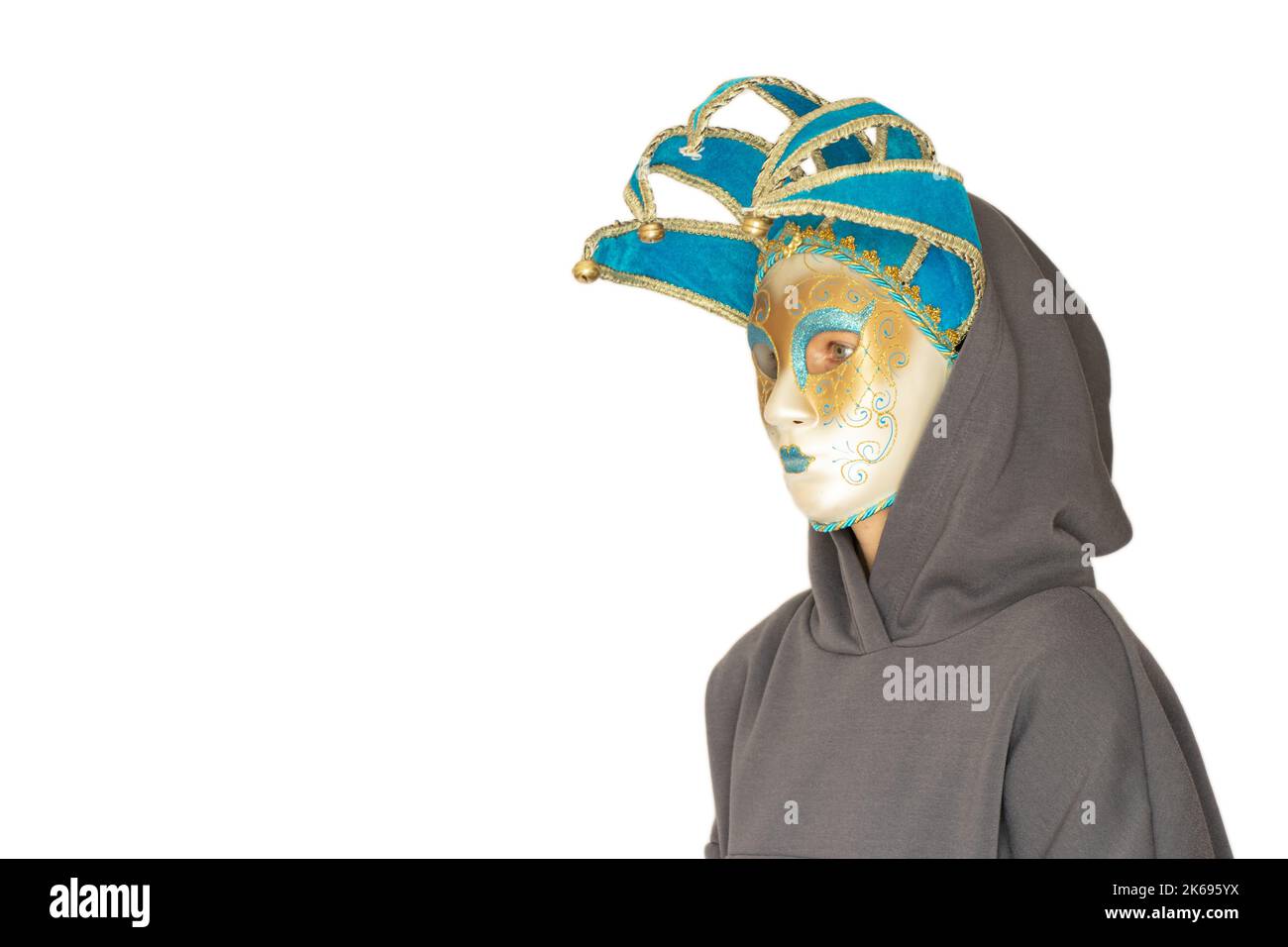 The face of a girl in a Venetian carnival mask on an isolated ...