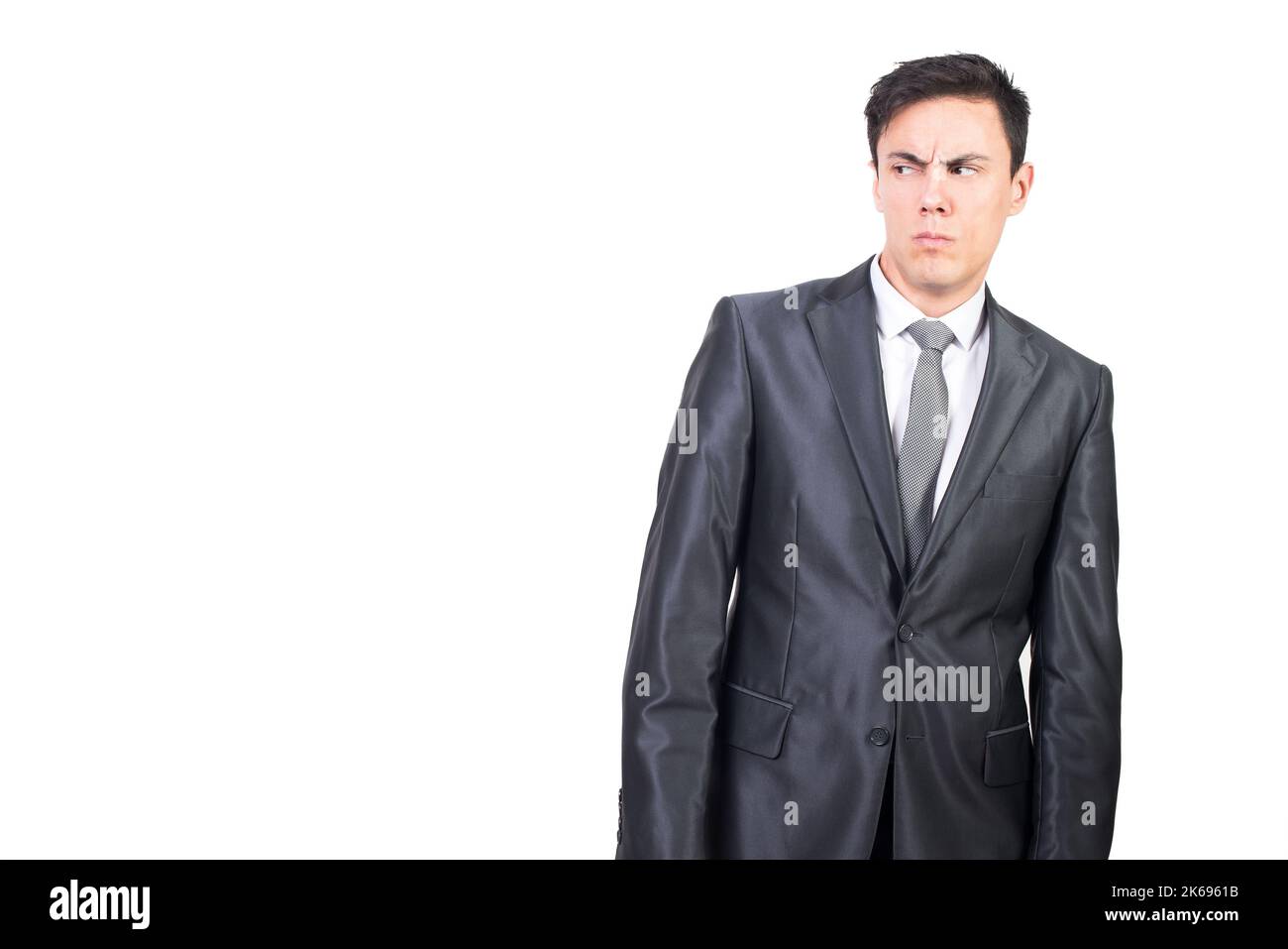 Suspicious man in classy suit staring with frowning face Stock Photo ...