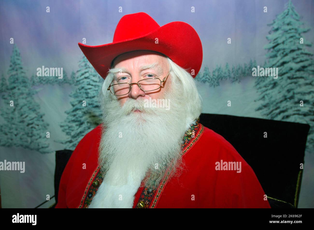 Santa in red Cowboy hat with real white beard at Christmas full face ...