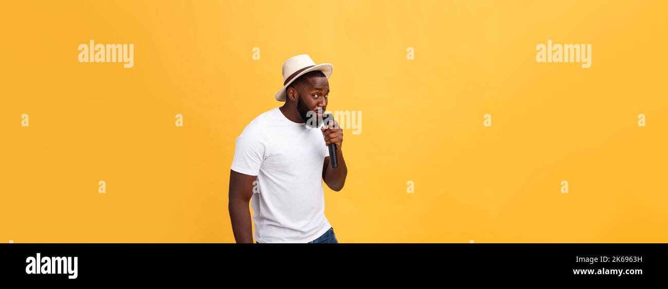young handsome african american boy singing emotional with microphone ...