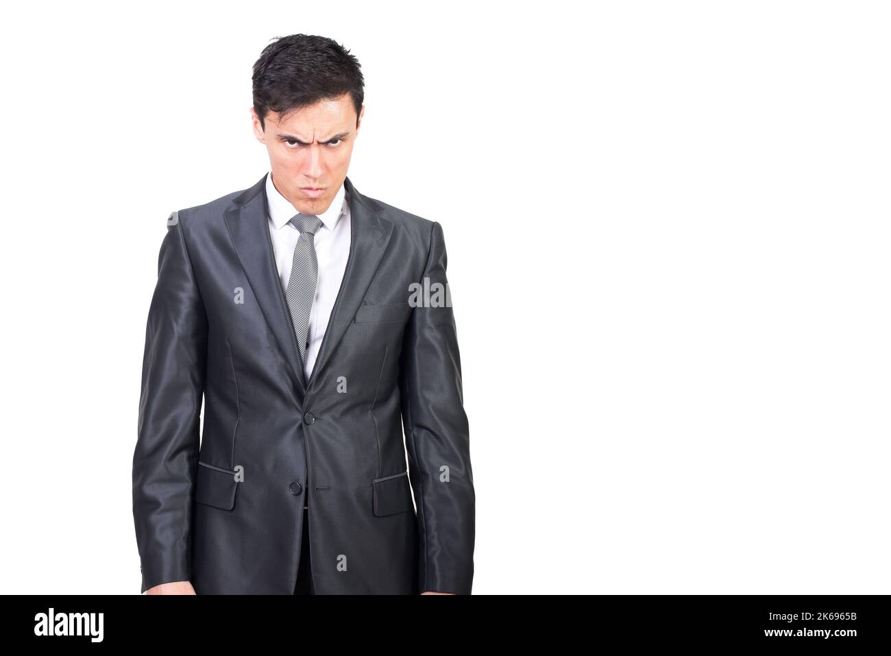 Angry man in formal suit feeling dissatisfied Stock Photo - Alamy