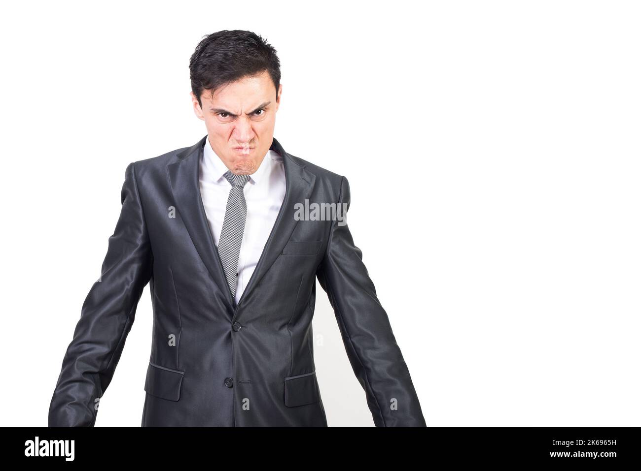 Angry man in elegant suit showing negative reaction Stock Photo - Alamy