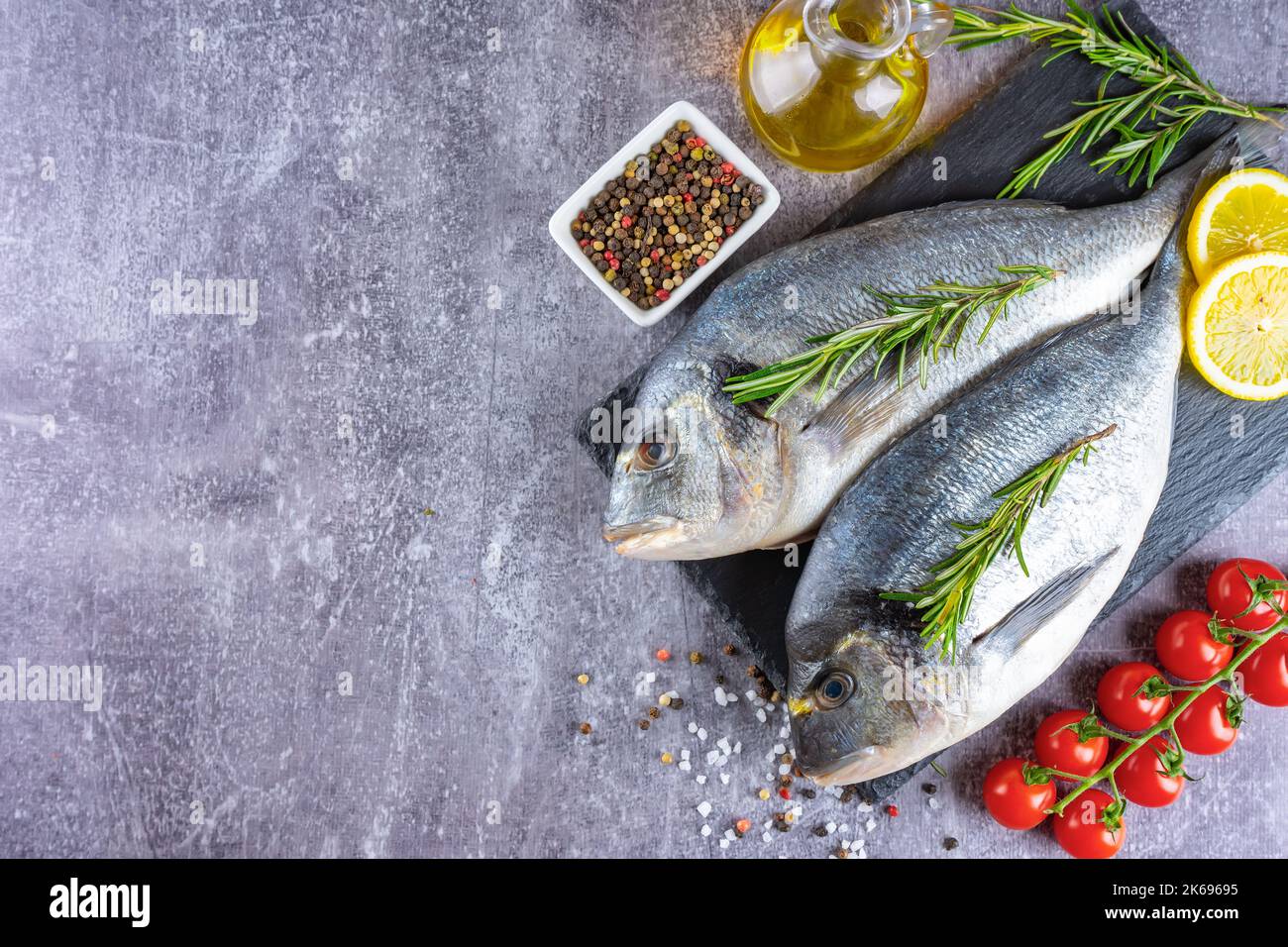 Dorado fish on gray concrete background with copy space. Sea food with ...