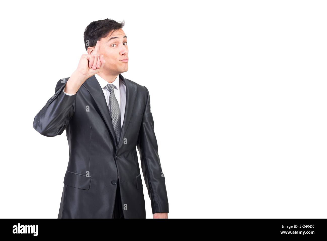 Smart man in formal wear pointing up Stock Photo - Alamy