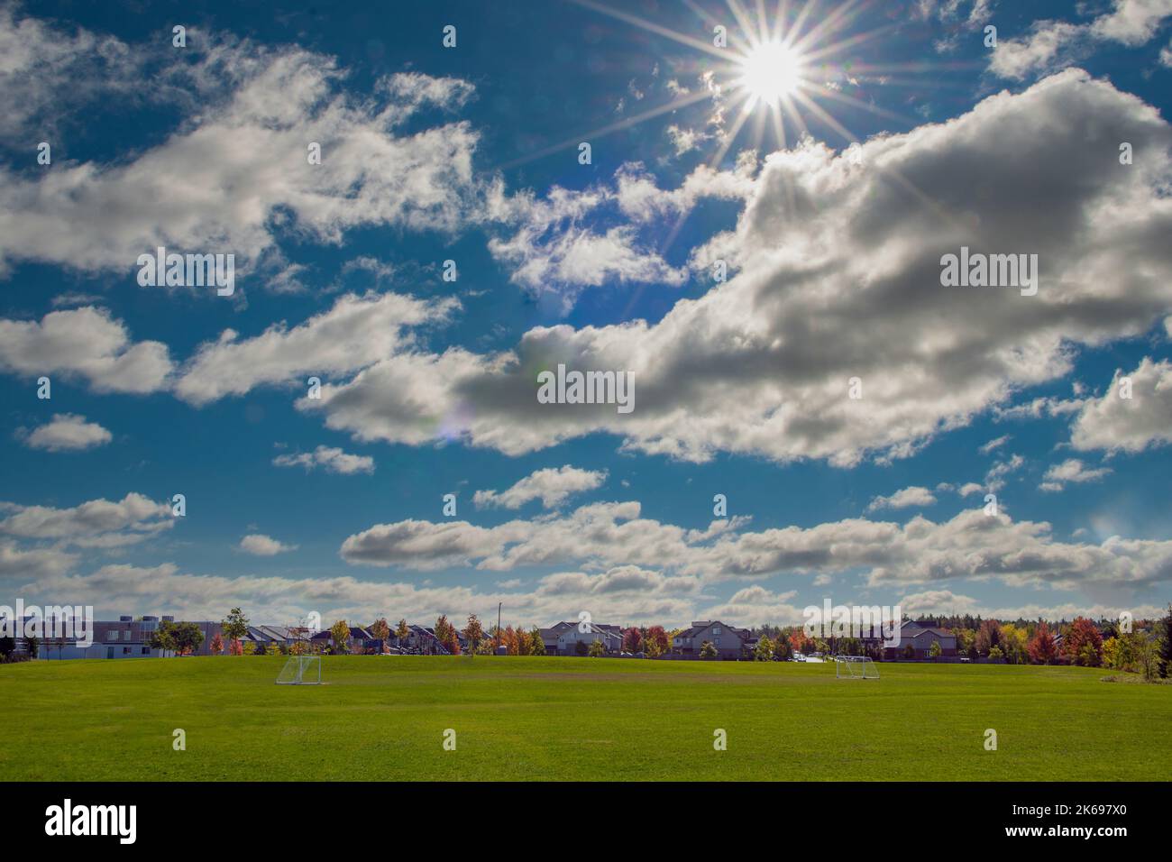 The sun broke through the clouds and illuminated a small town Stock ...