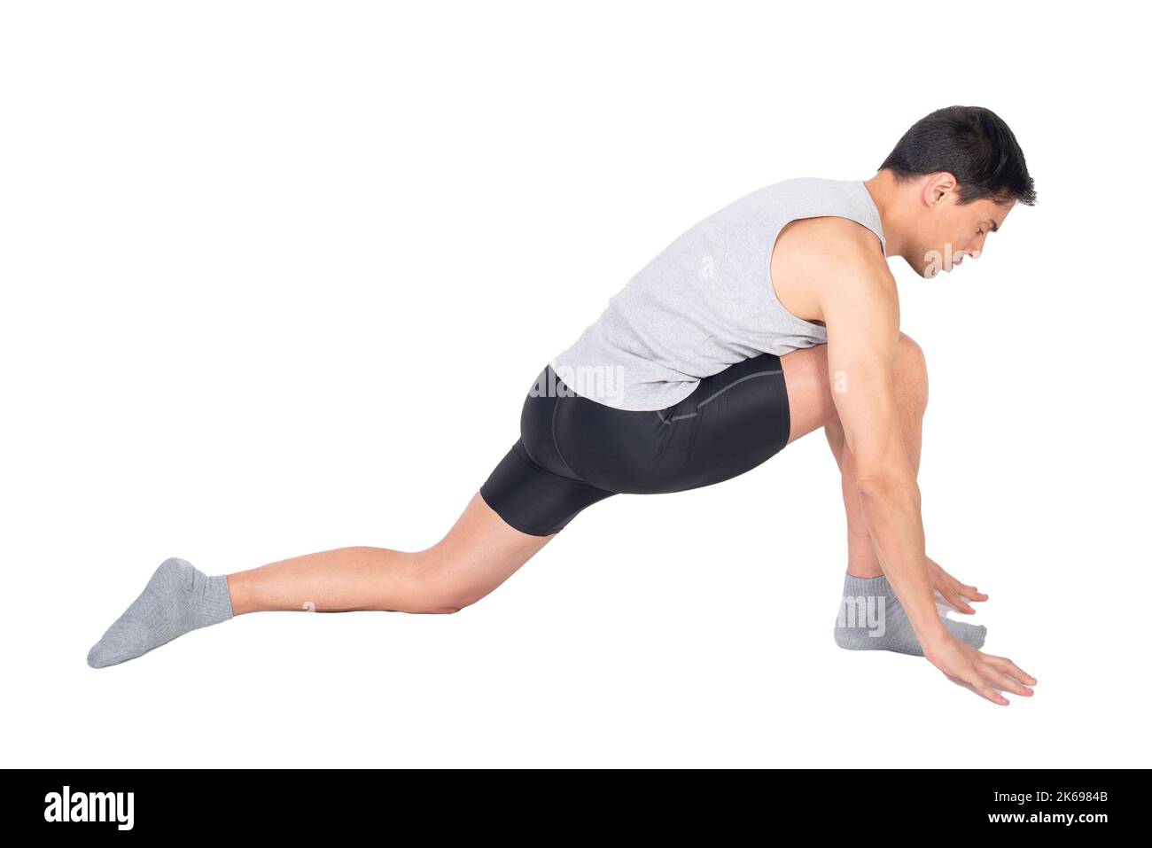 Determined sportsman stretching psoas muscle in studio Stock Photo - Alamy