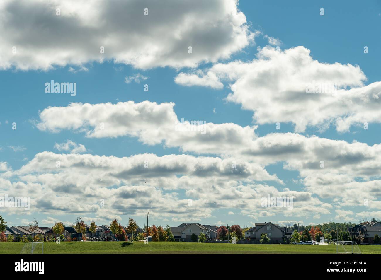 A small town under a big, blue sky with beautiful clouds Stock Photo ...