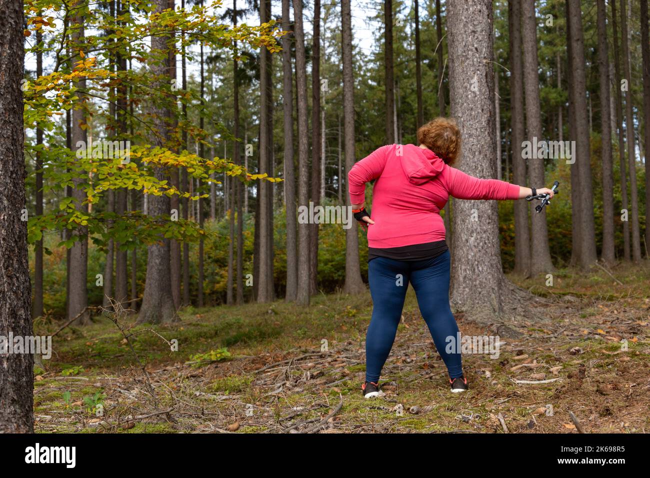 Plus size woman doing gymnastics in the autumn forest Stock Photo - Alamy