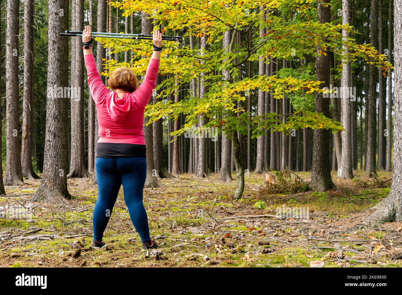 Plus size woman doing gymnastics in the autumn forest Stock Photo - Alamy
