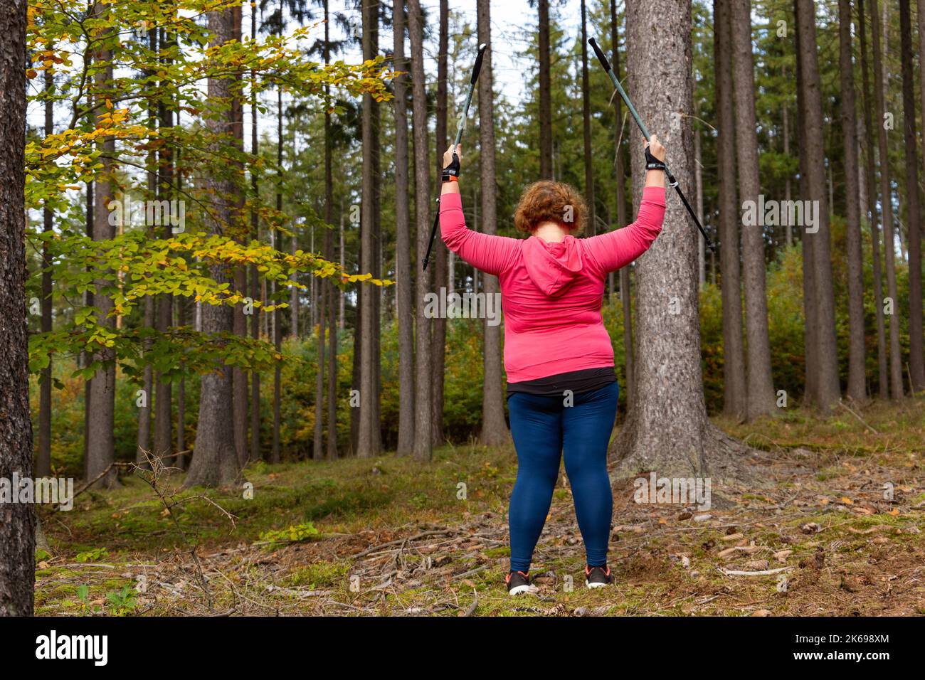 Plus size woman doing gymnastics in the autumn forest Stock Photo - Alamy