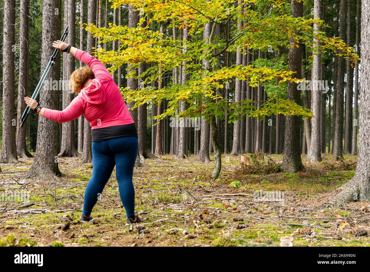 Plus size woman doing gymnastics in the autumn forest Stock Photo - Alamy