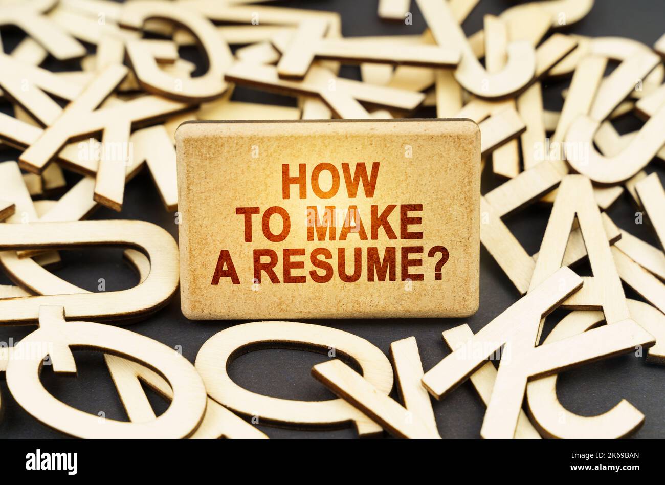 Education concept. Among the wooden letters is a sign with the ...