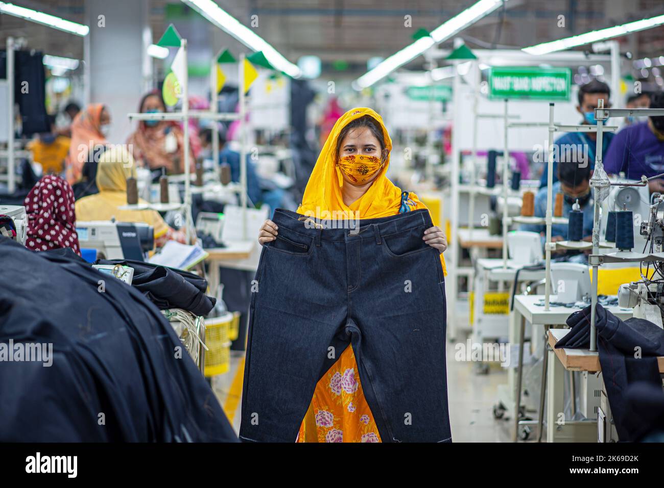 Gazipur, Dhaka, Bangladesh. 12th Oct, 2022. Workers make clothes at a ...