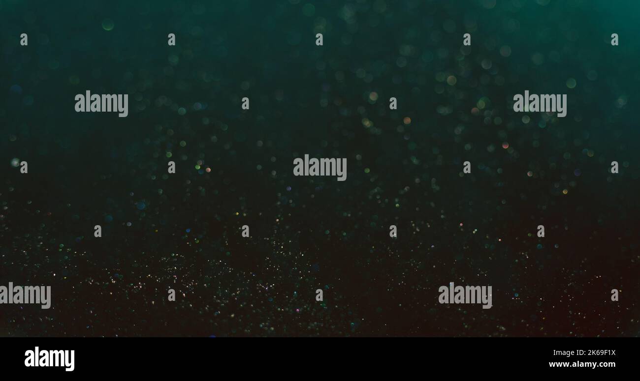 particles background bokeh sparks texture teal Stock Photo - Alamy