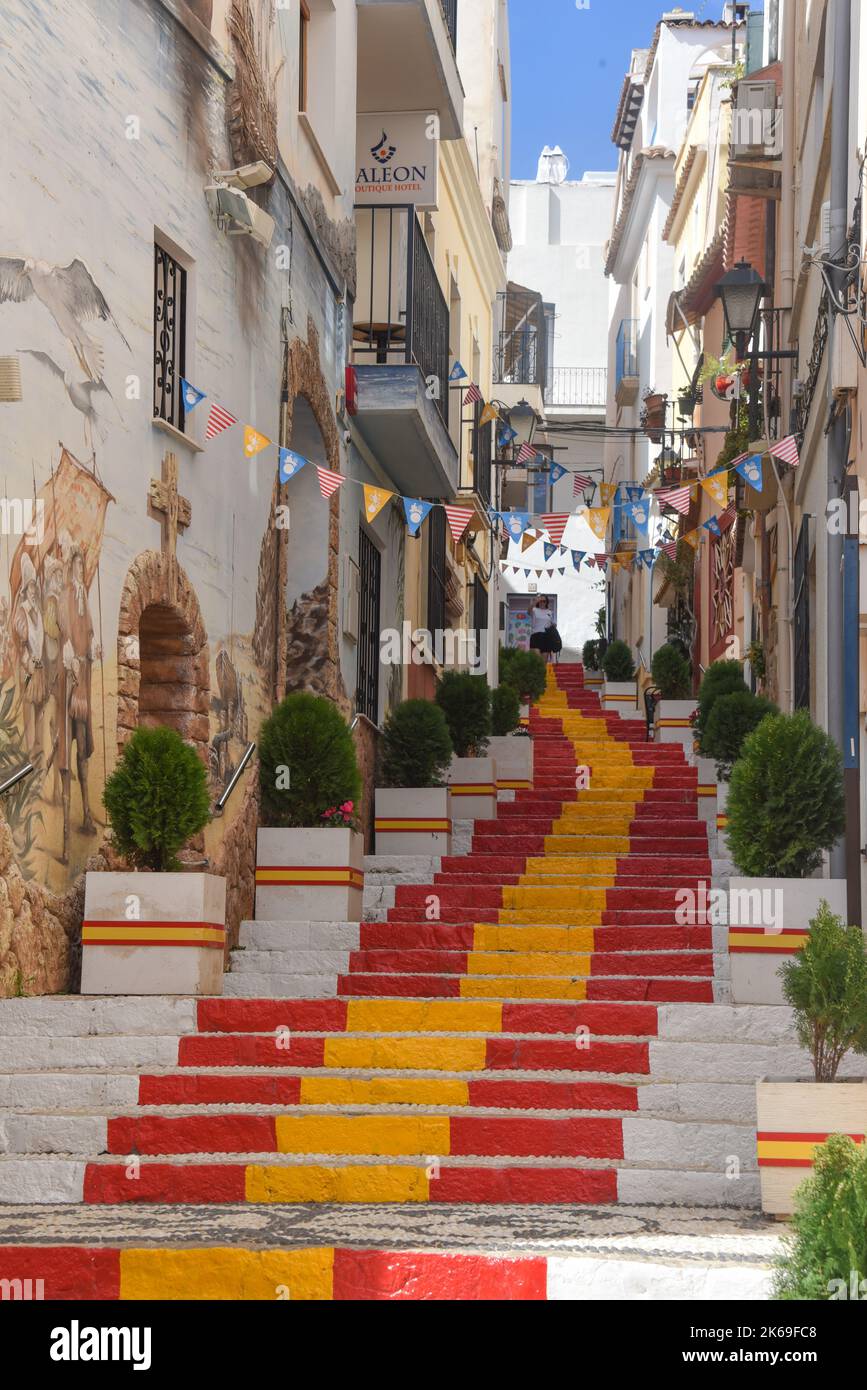 Steps painted in the colour of the Spanish Flag. Calpe, Alicante, Spai ...