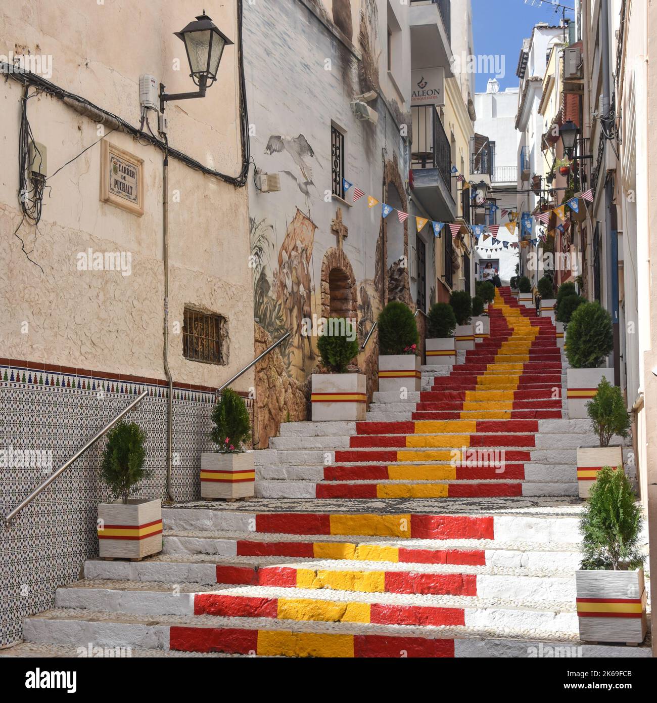 Steps painted in the colour of the Spanish Flag. Calpe, Alicante, Spai ...