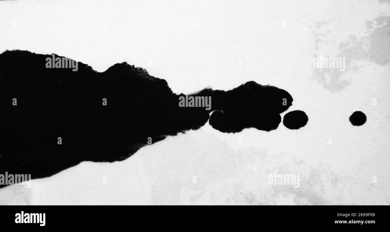 black ink spatter on white paper dye drop texture Stock Photo - Alamy