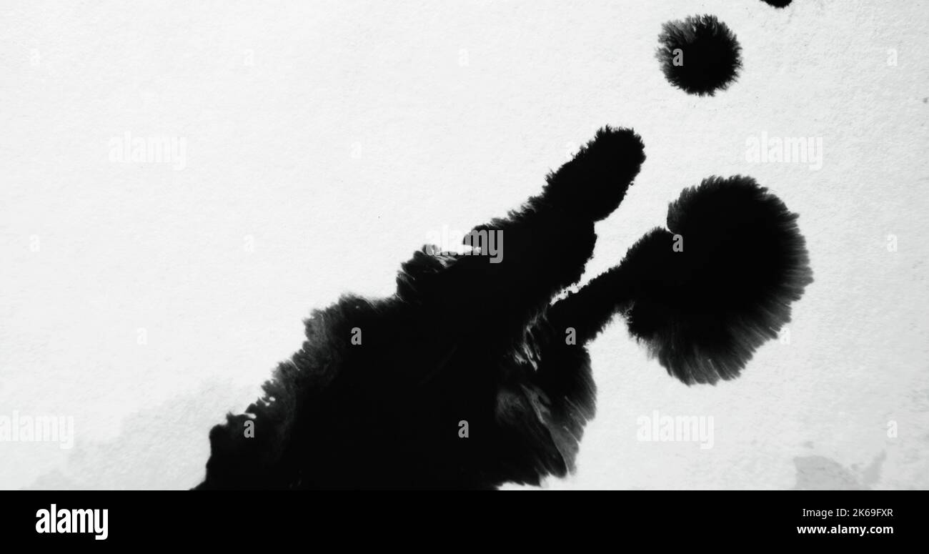 black ink splash on white paper stain texture drop Stock Photo - Alamy