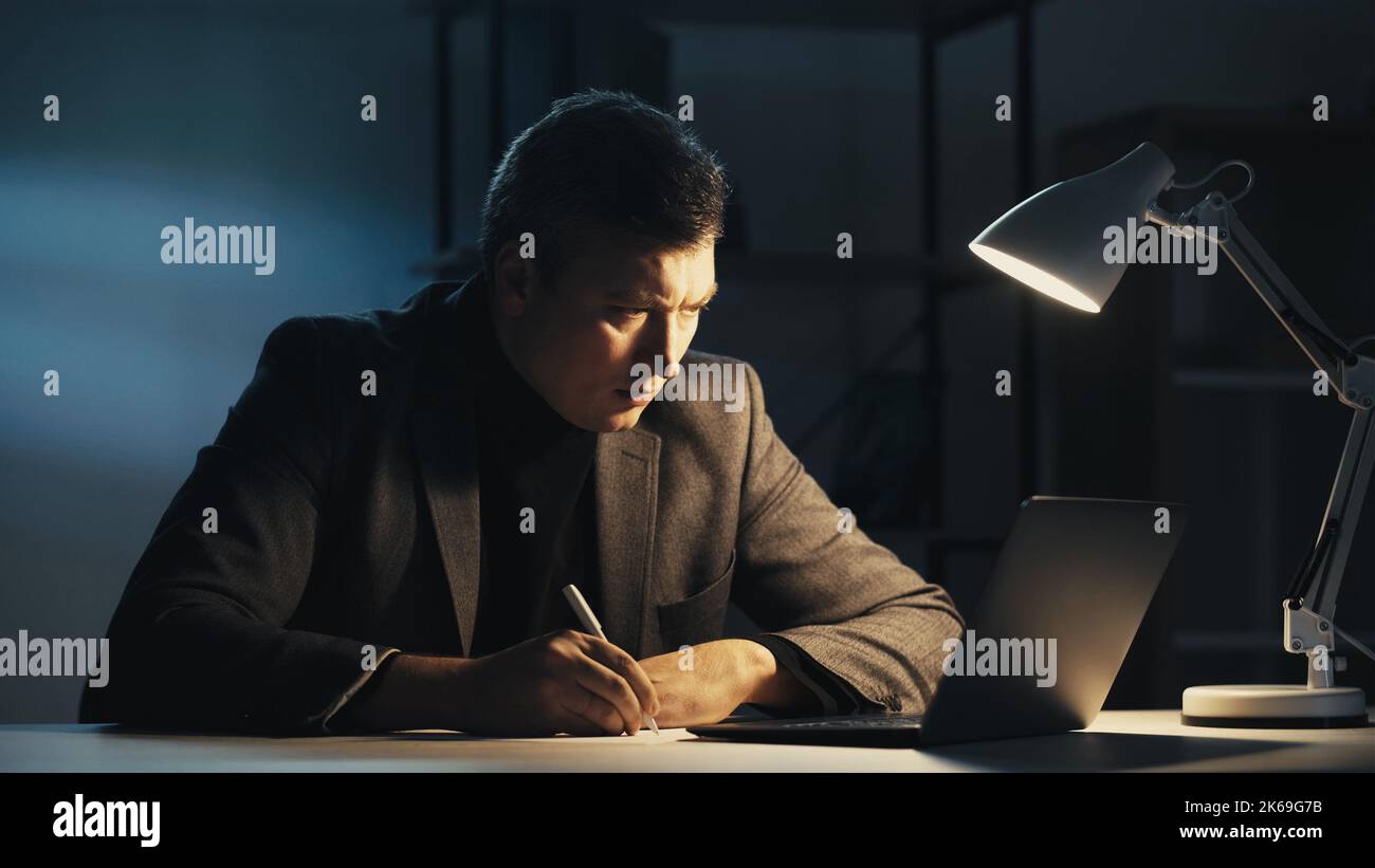 overworking man work stress task deadline Stock Photo - Alamy