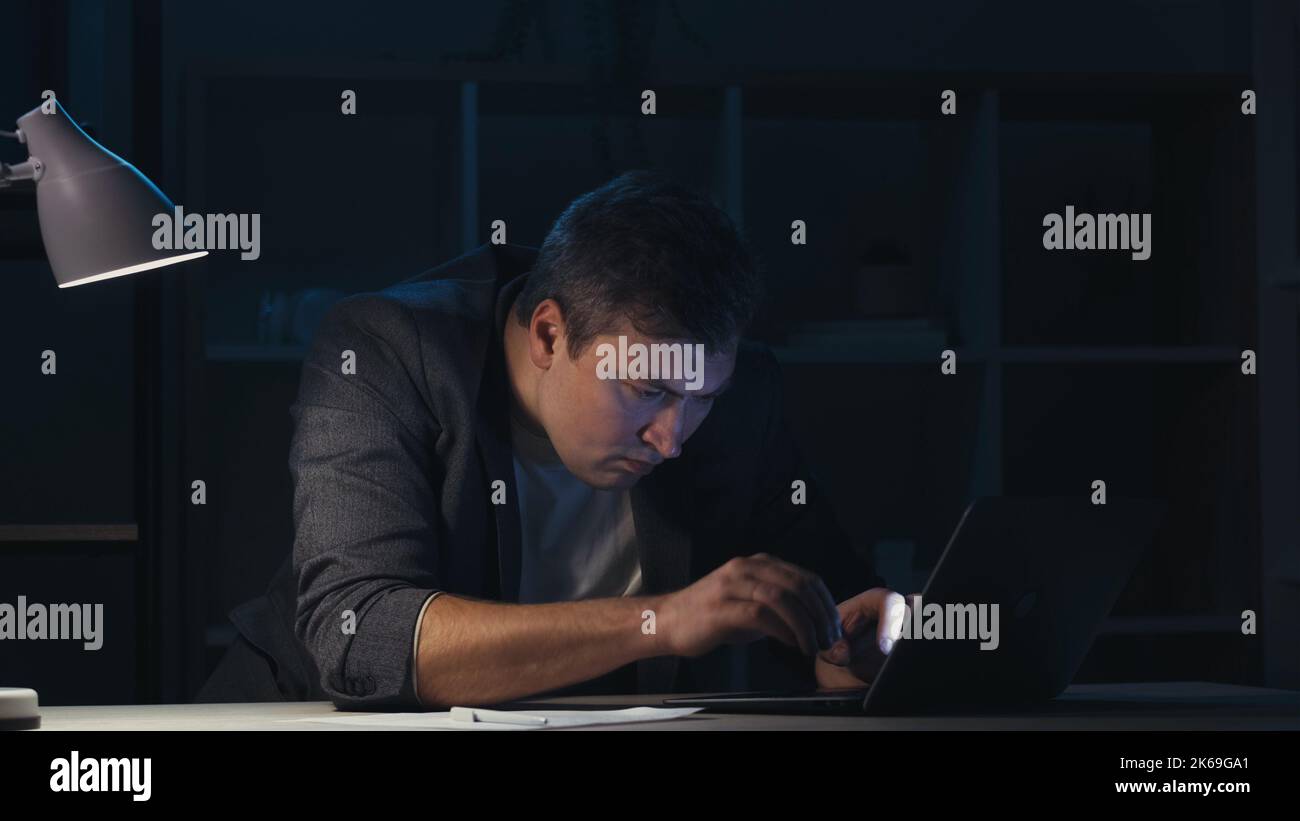 night work concentrated man digital Stock Photo - Alamy