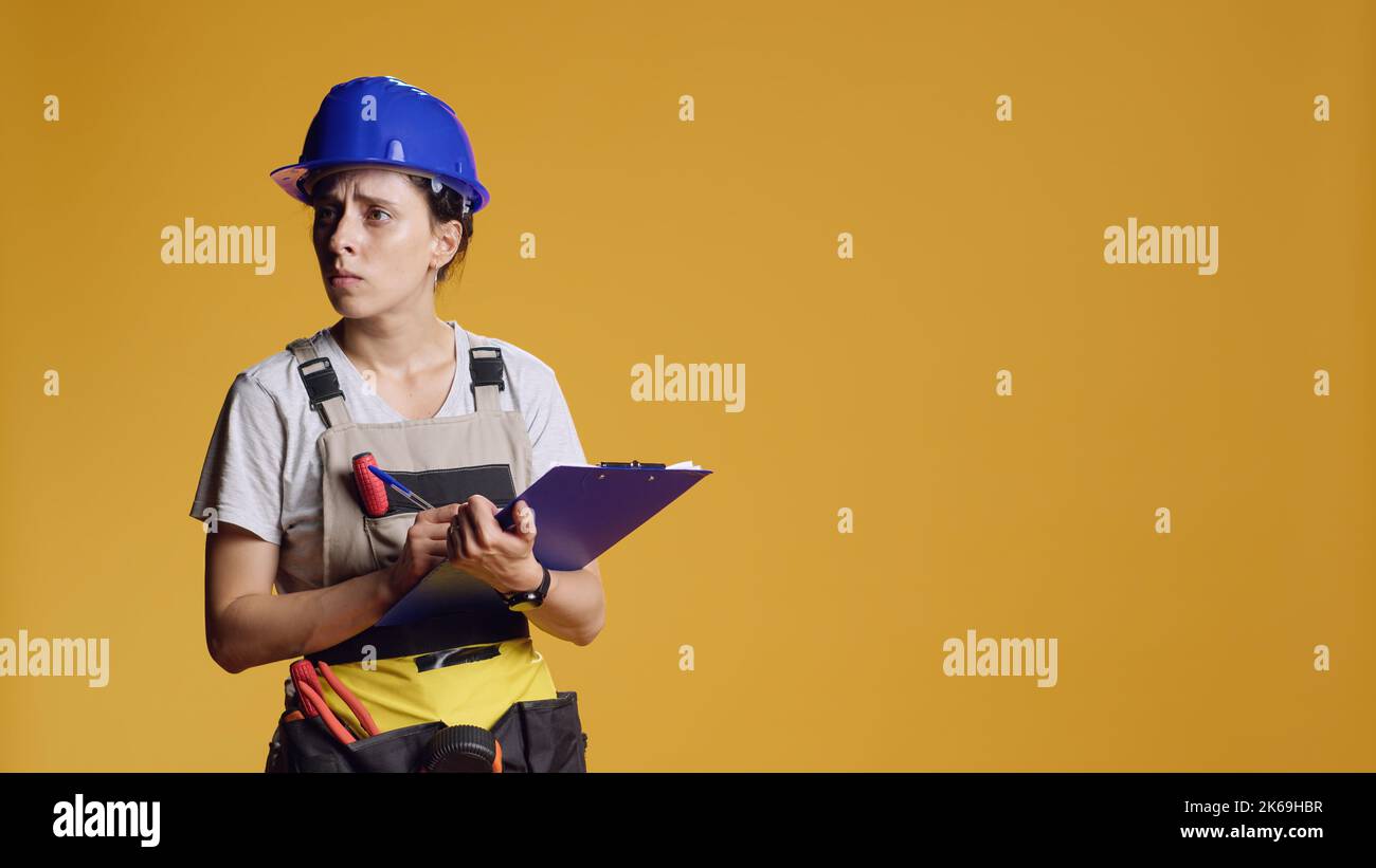 Portrait of construction worker taking notes and doing architecture ...