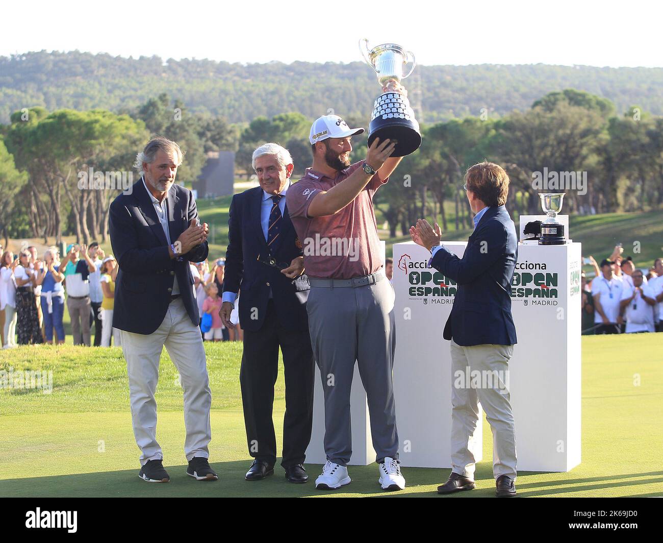 Spanish player Jon Rahm lifts the trophy at the prize giving ceremony ...