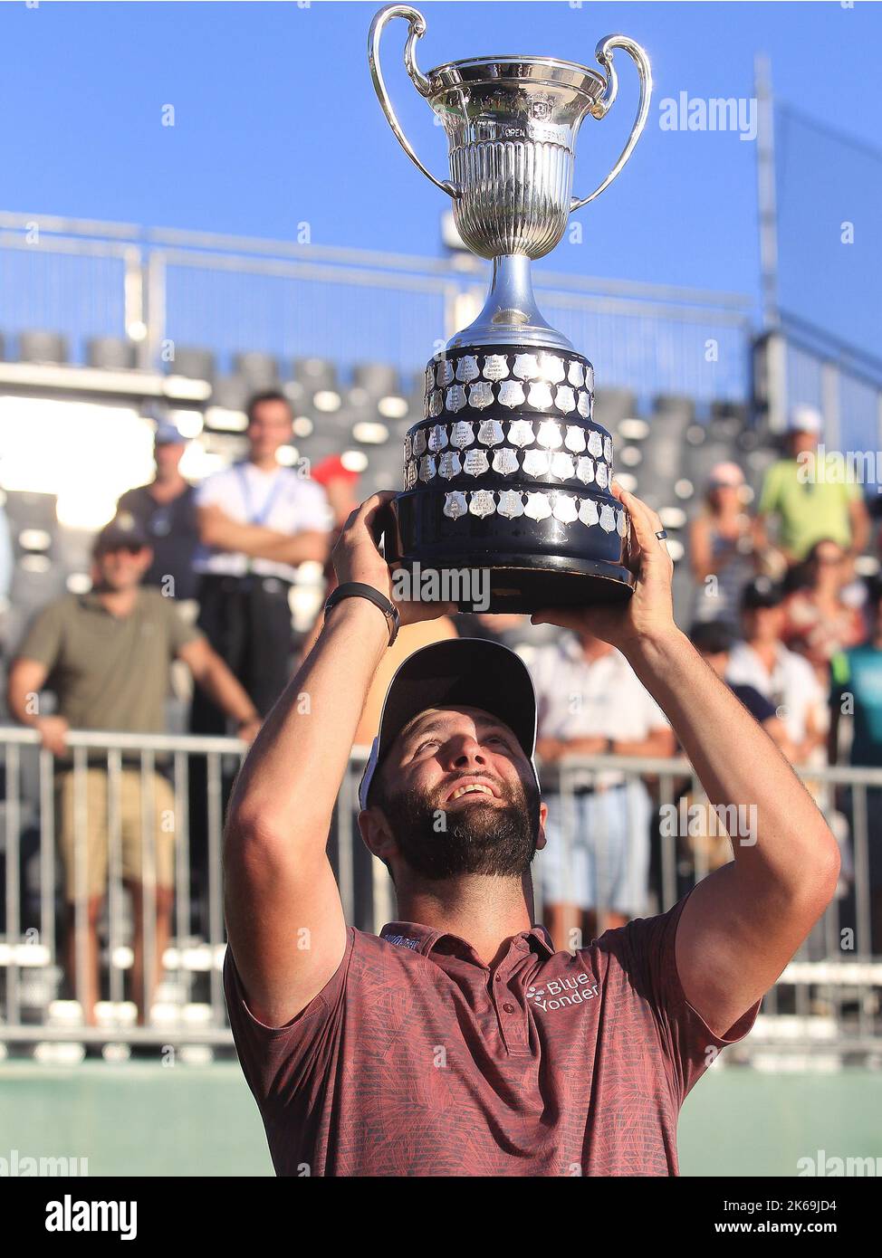 Spanish player Jon Rahm lifts the trophy at the prize giving ceremony ...