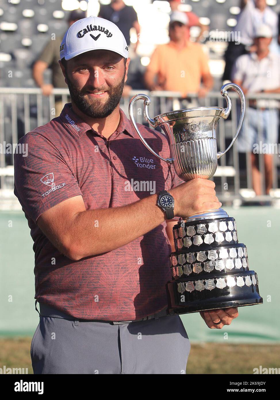 Spanish player Jon Rahm lifts the trophy at the prize giving ceremony ...