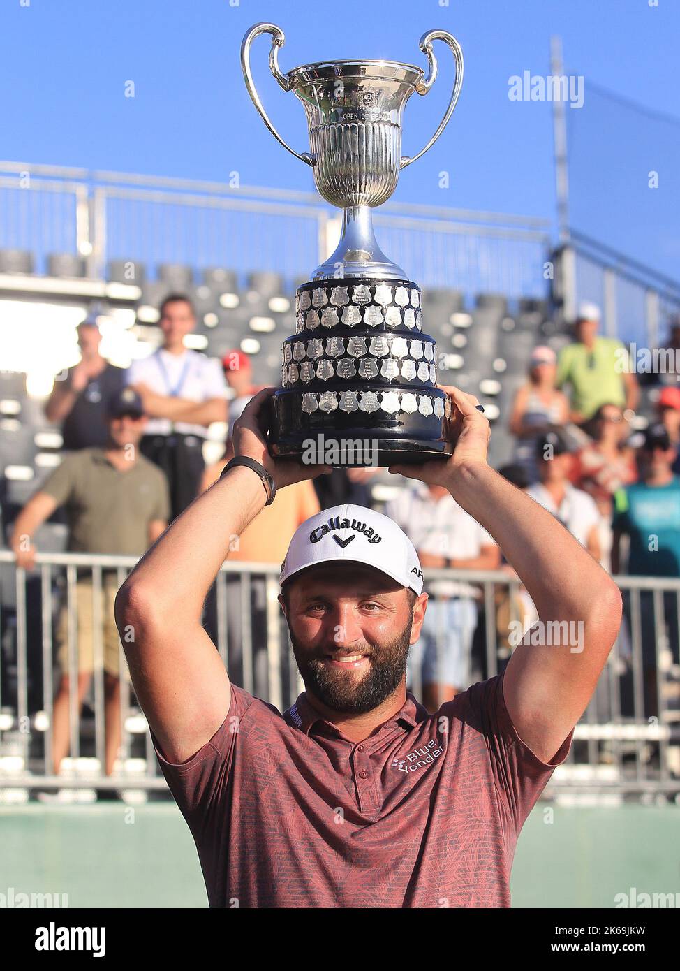 Spanish player Jon Rahm lifts the trophy at the prize giving ceremony ...