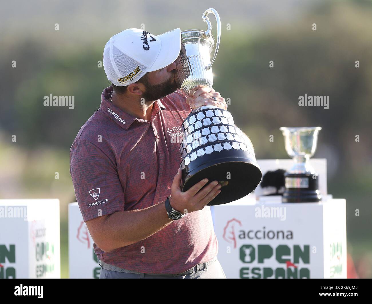 Spanish player Jon Rahm lifts the trophy at the prize giving ceremony ...