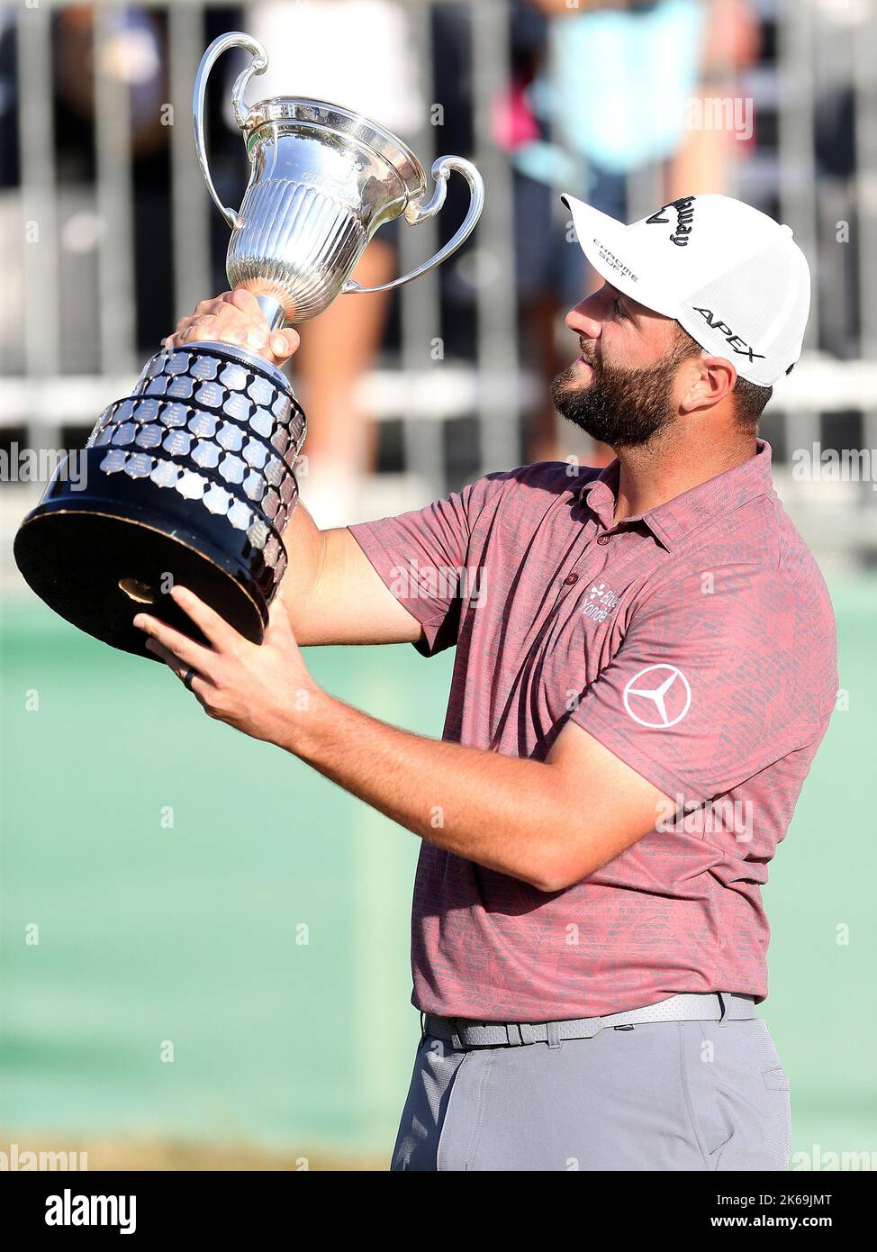 Spanish player Jon Rahm lifts the trophy at the prize giving ceremony ...