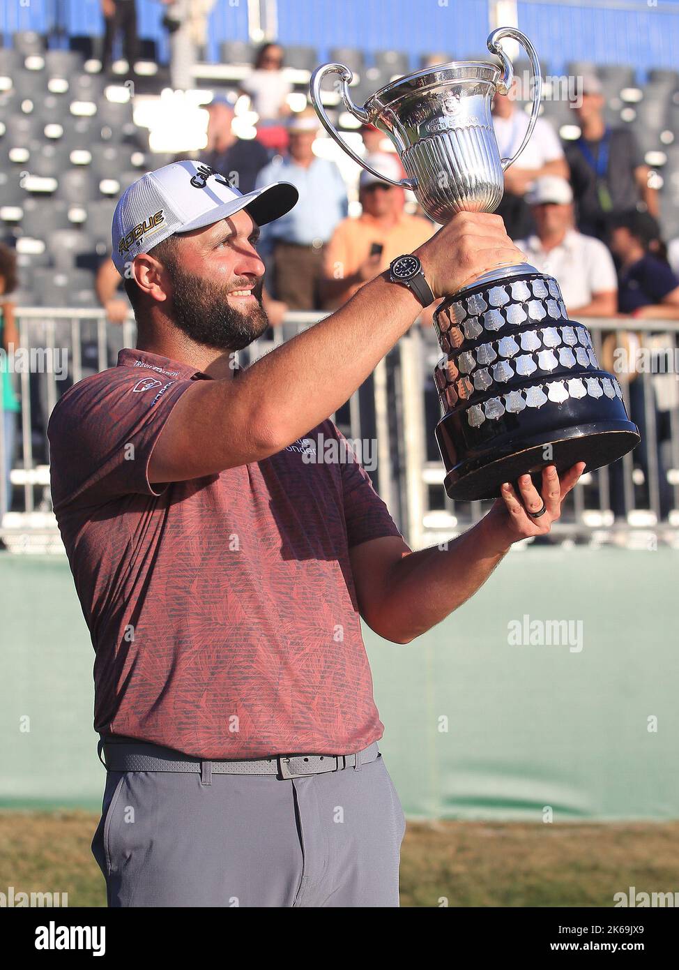 Spanish player Jon Rahm lifts the trophy at the prize giving ceremony ...