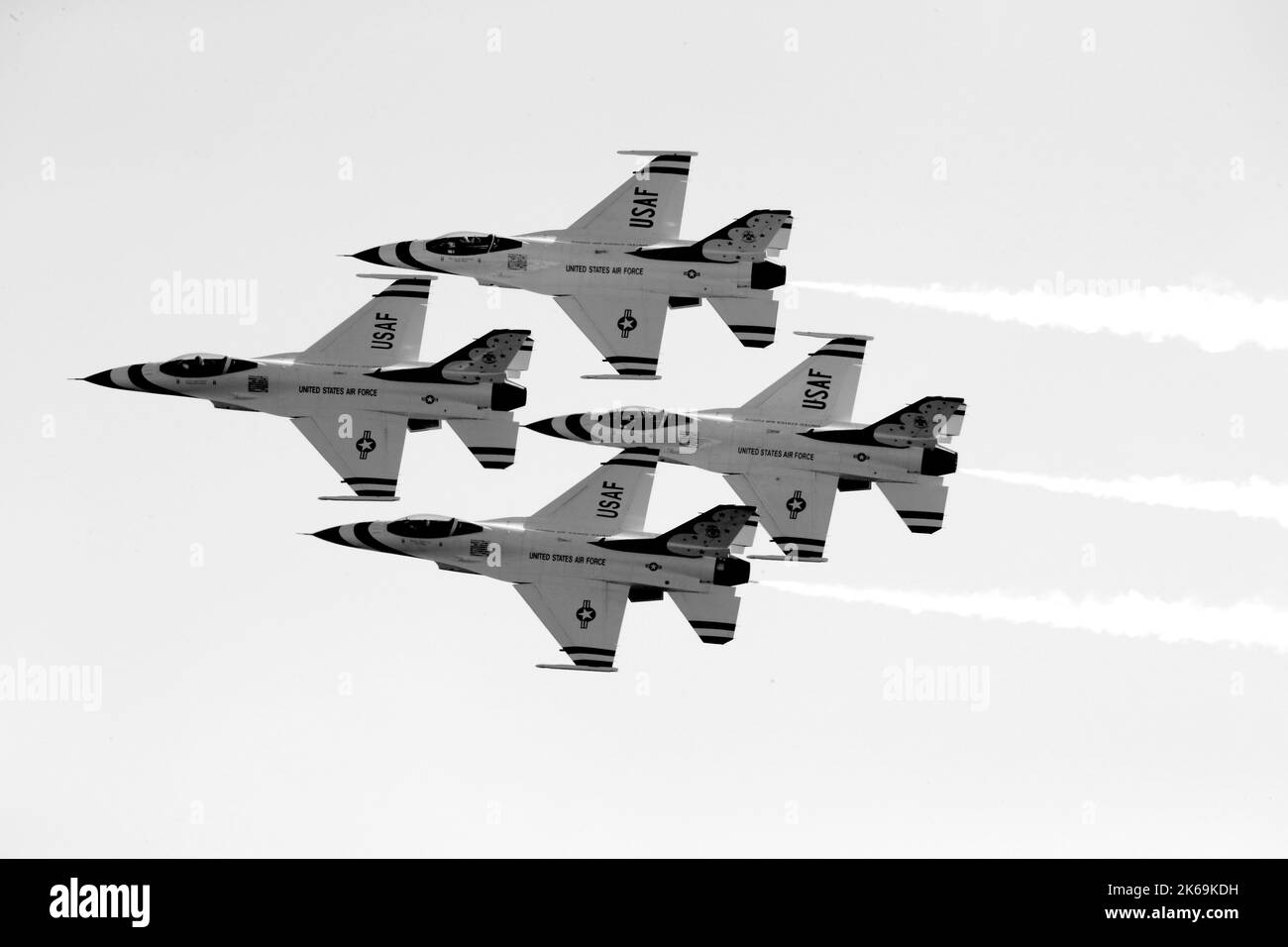 A grayscale shot of four USAF aircraft in a flight at the annual ...