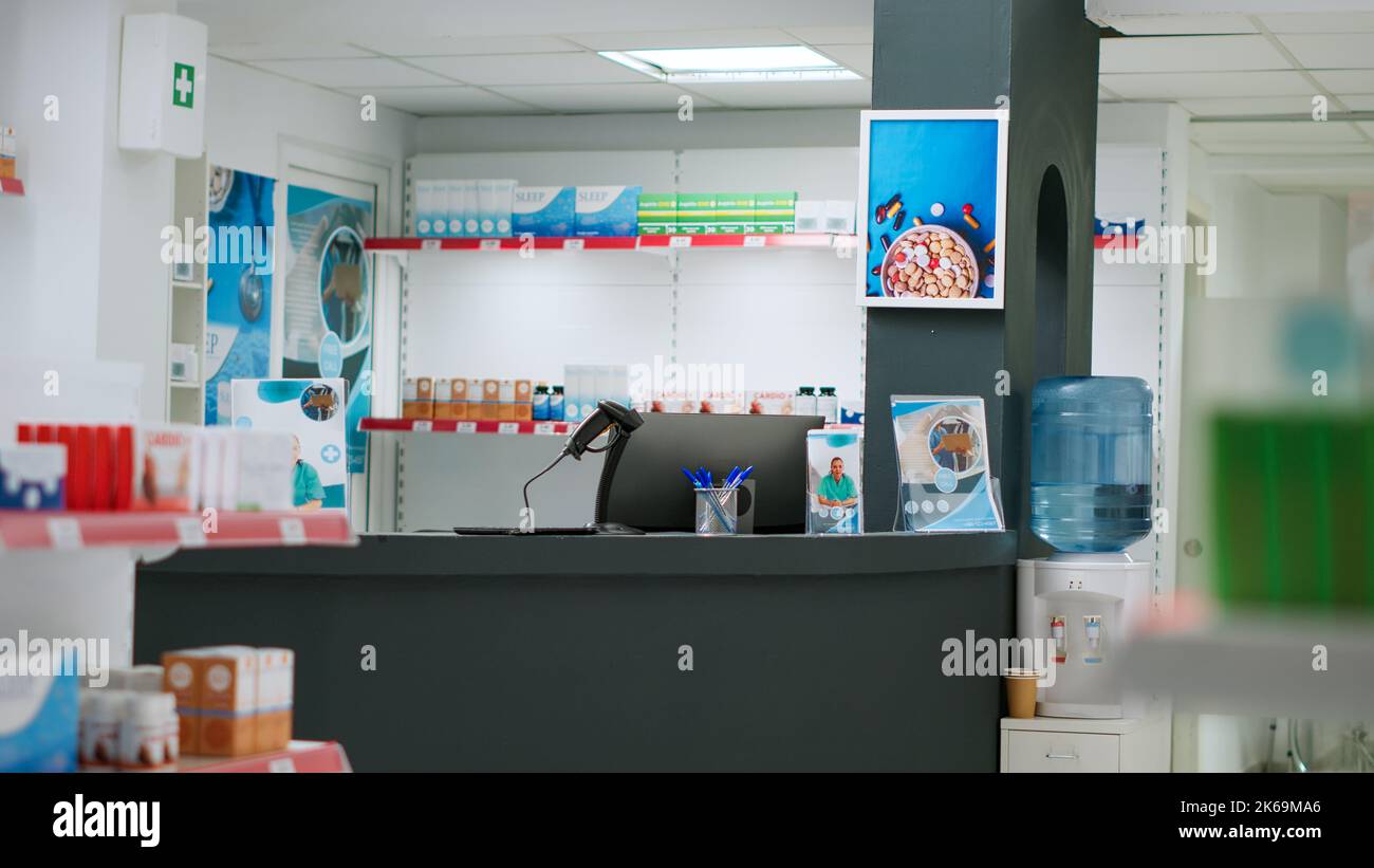 Pharmacy counter desk with shelves showing medicaments and ...