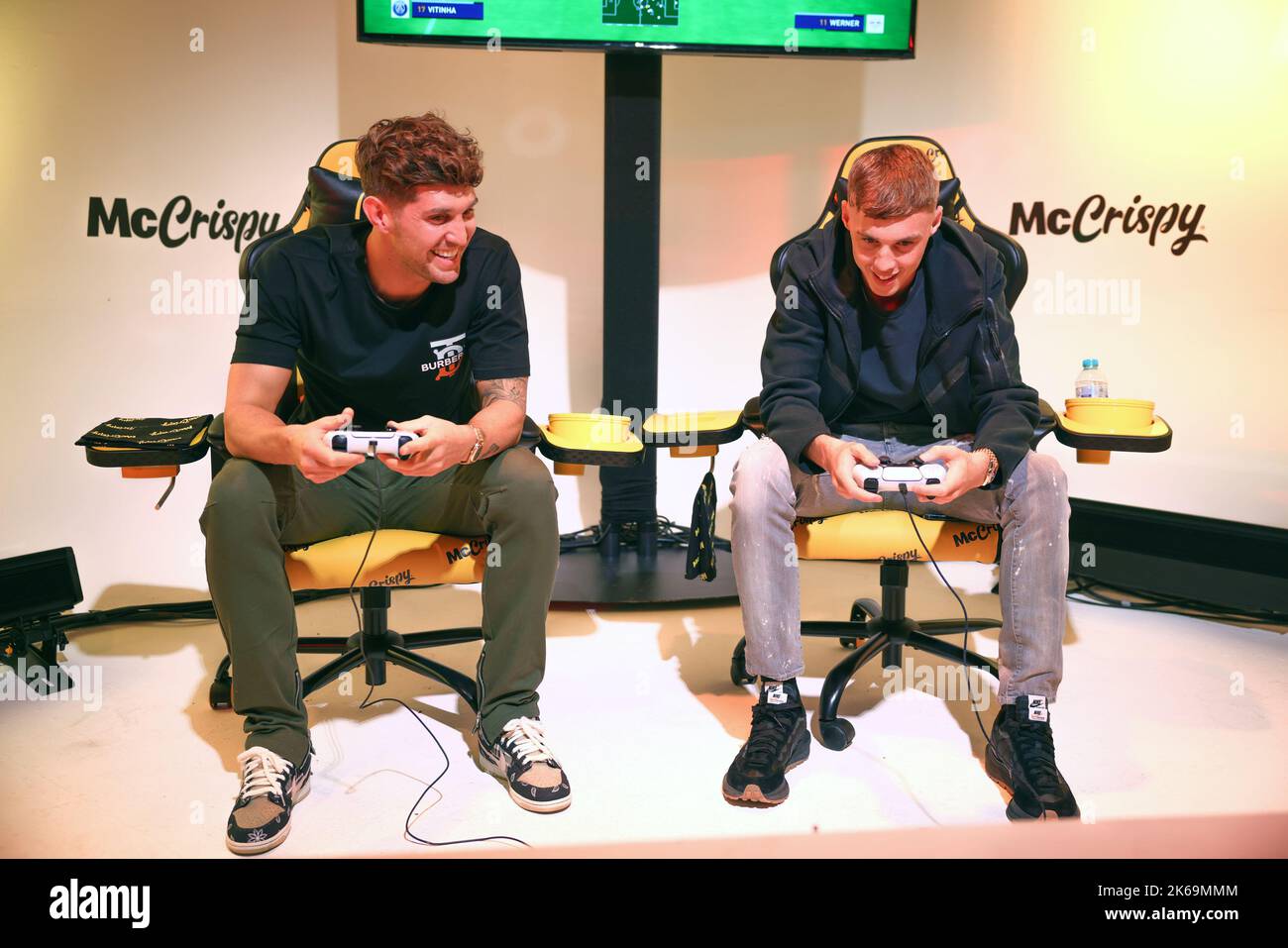 EDITORIAL USE ONLY Cole Palmer and John Stones (left) attend McDonald's ...