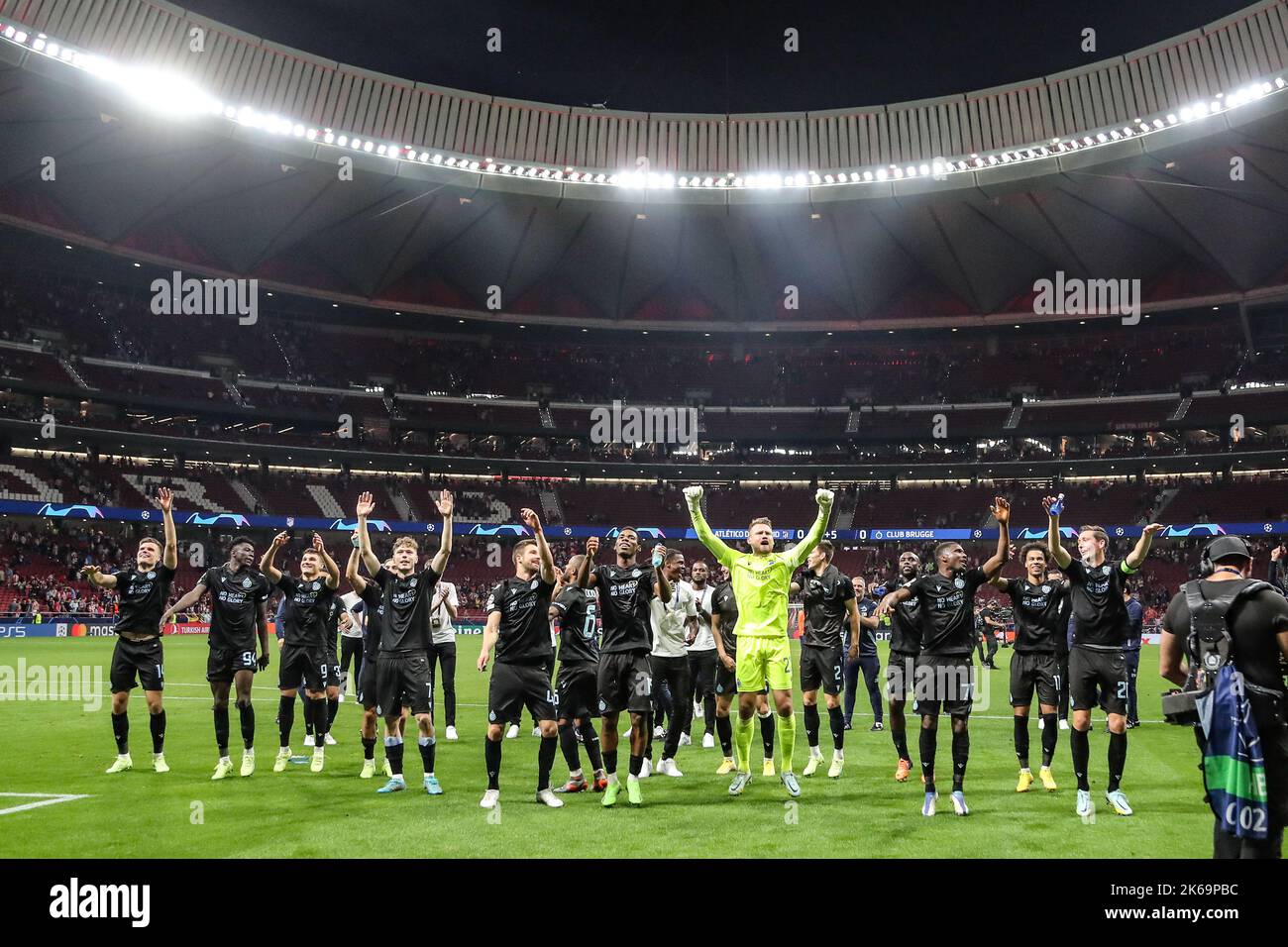 Club's players celebrate after a group stage soccer game between ...
