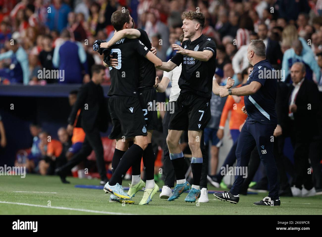 Club's players celebrate after a group stage soccer game between ...