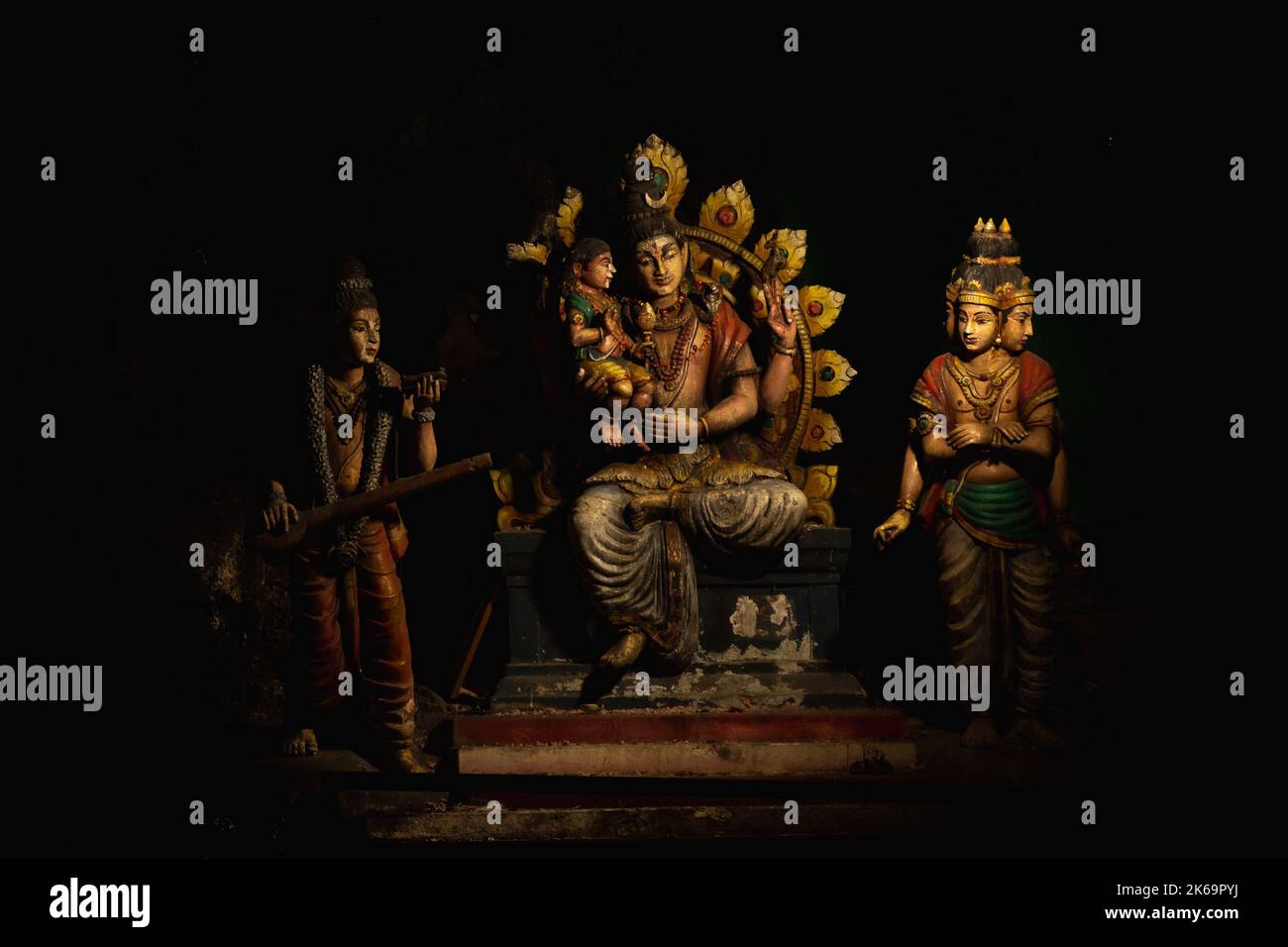 A closeup of Indian god statues with a black background Stock Photo - Alamy