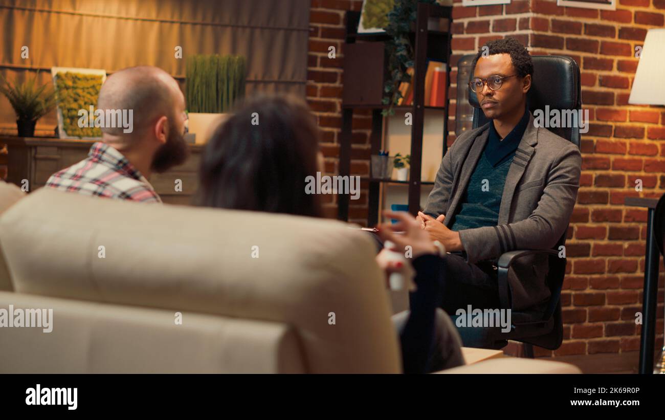 Psychologist consulting unhappy people with relationship problems ...