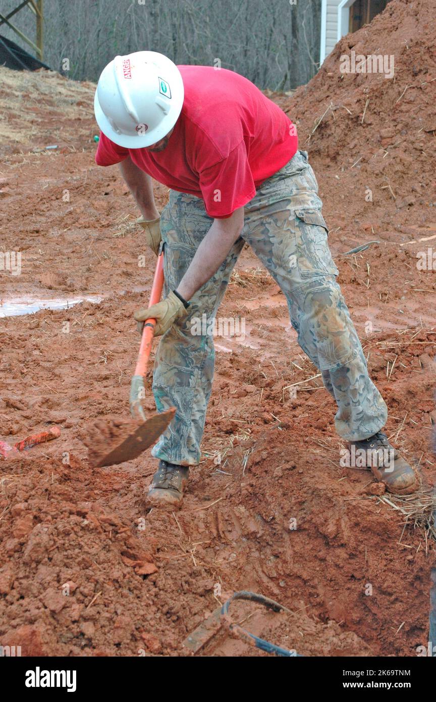 workman Installing telephone and power cable to new home house ...