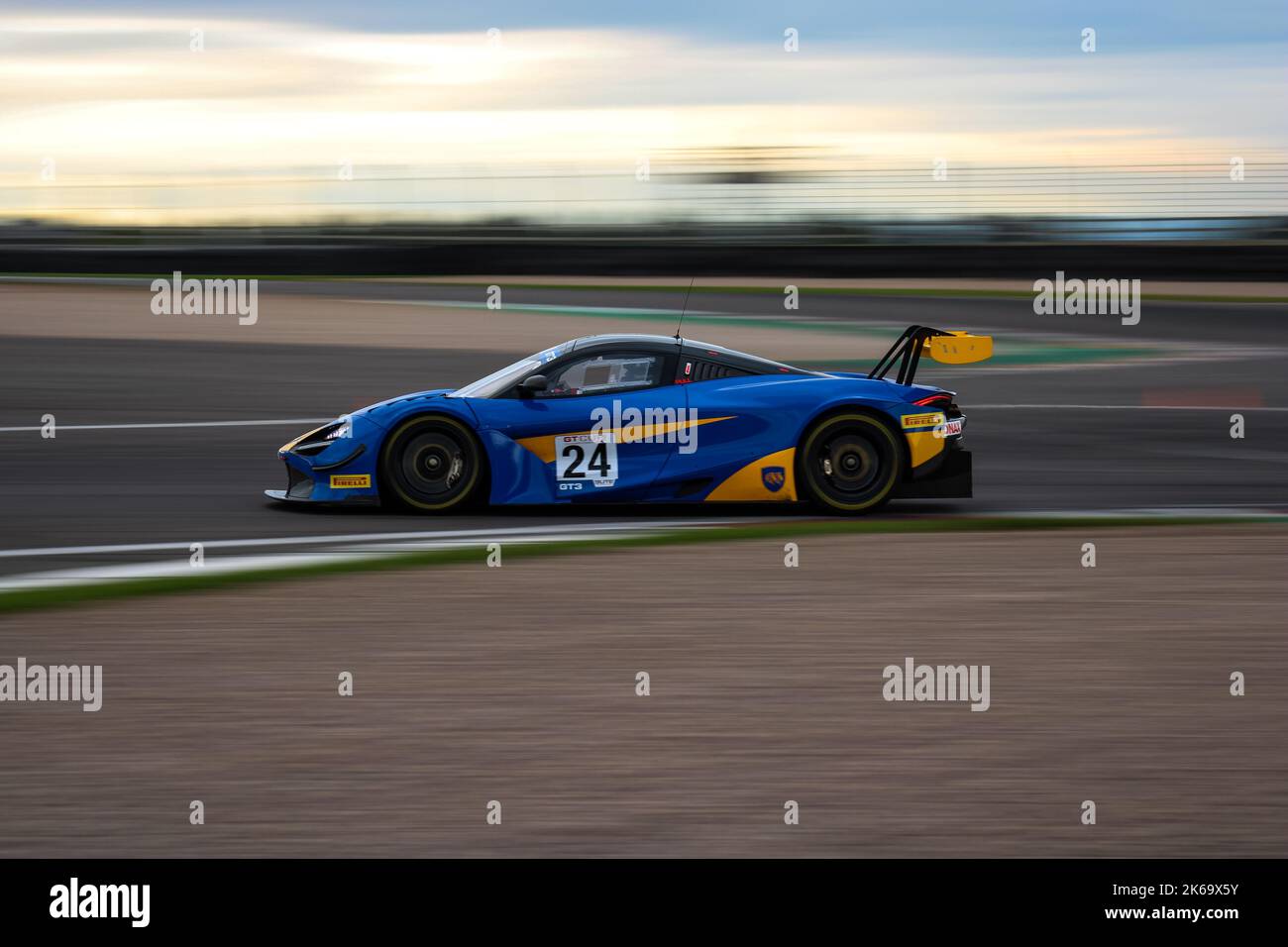A McLaren 720s GT3 racing in GT Cup at the Donington Park Circuit Stock ...